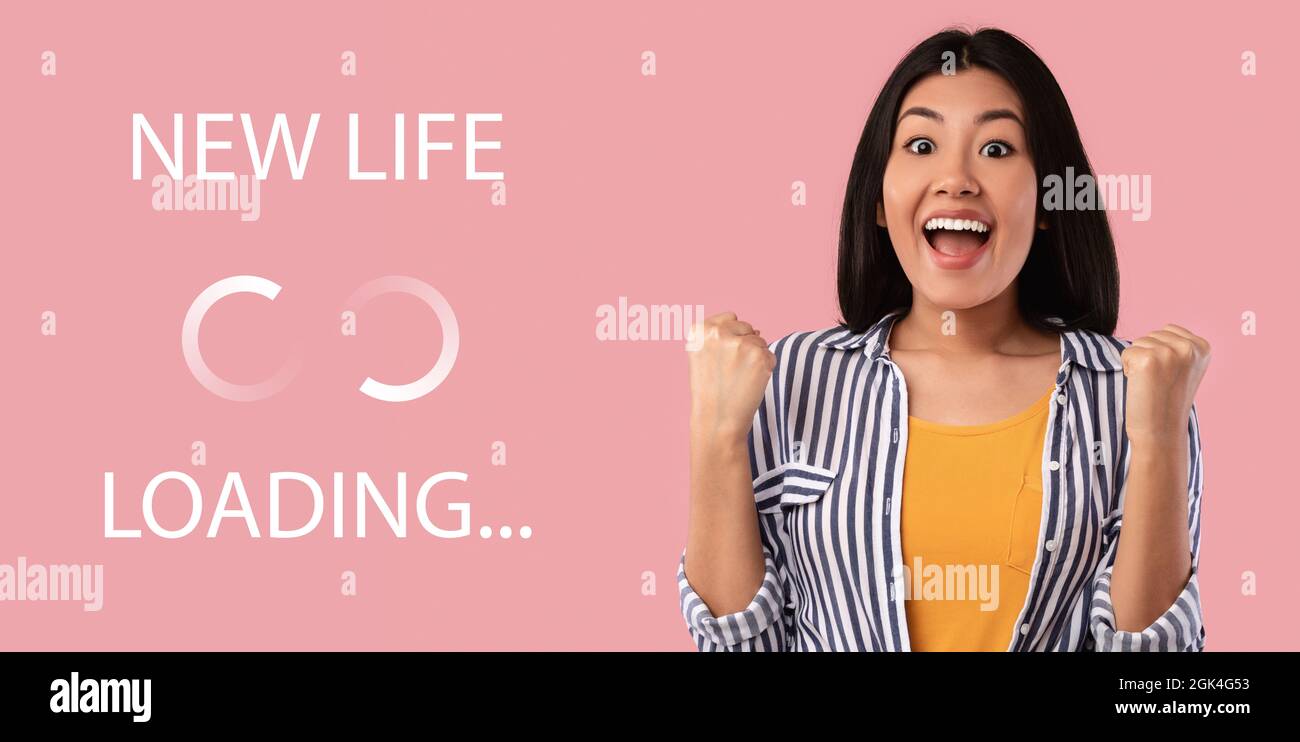 Excited young Asian woman gesturing YES on pink studio background with ...