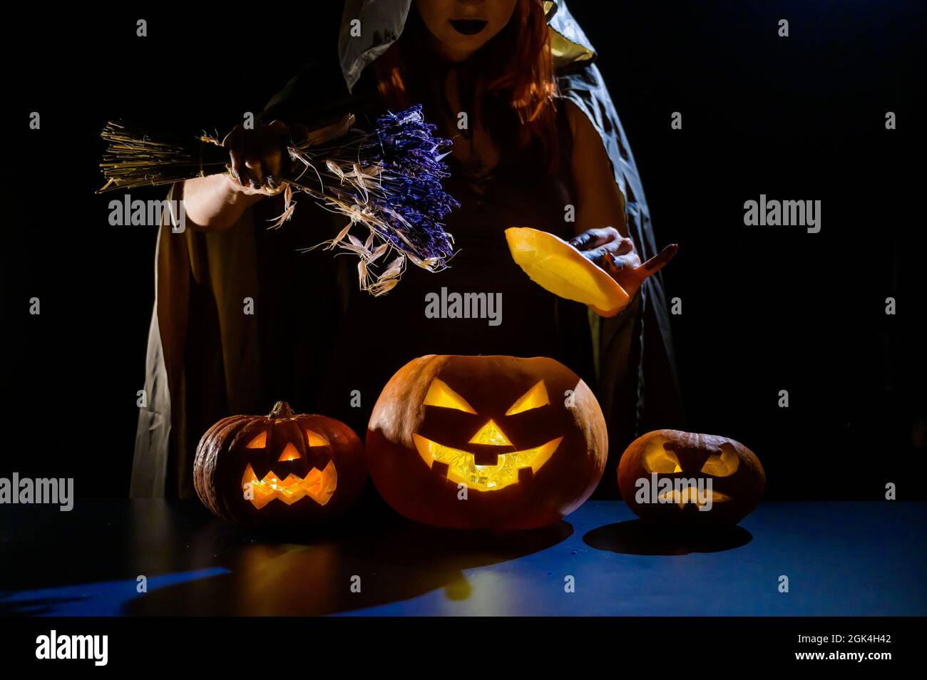 A witch casts a spell in the dark on halloween eve Stock Photo - Alamy