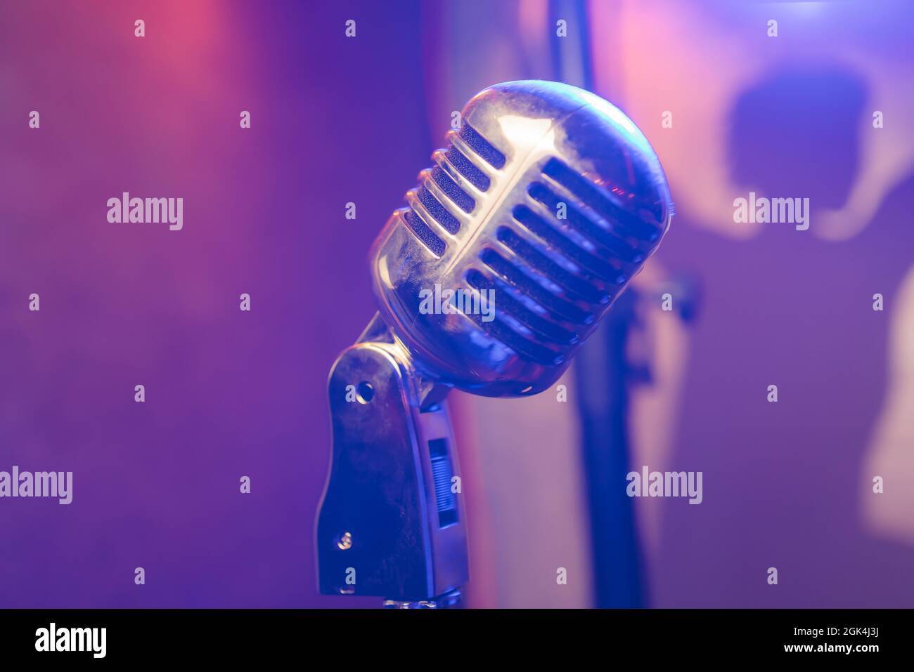 Retro microphone on stage in a pub or American Bar restaurant during a ...