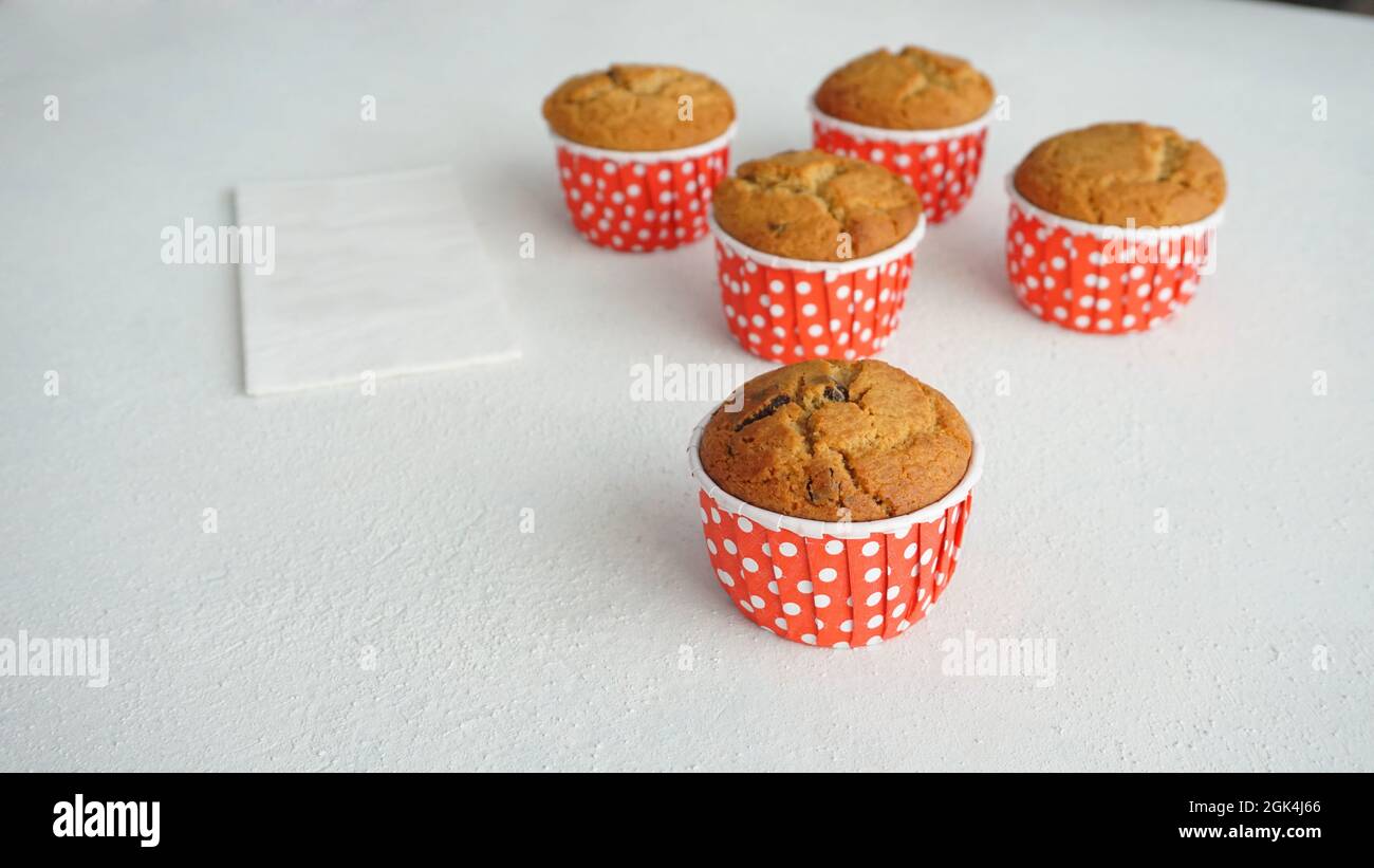five muffins on white background Stock Photo - Alamy