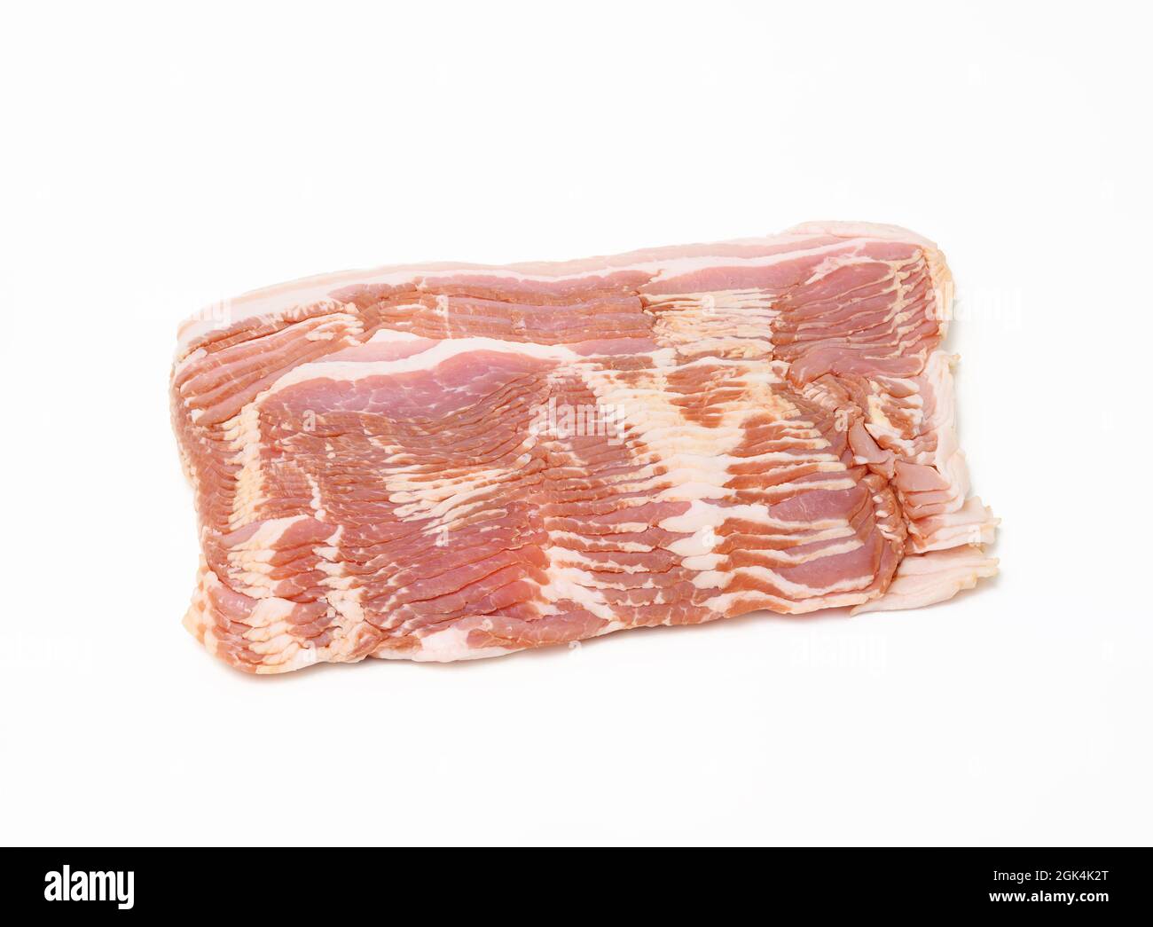 a stack of sliced raw bacon on a white background Stock Photo - Alamy