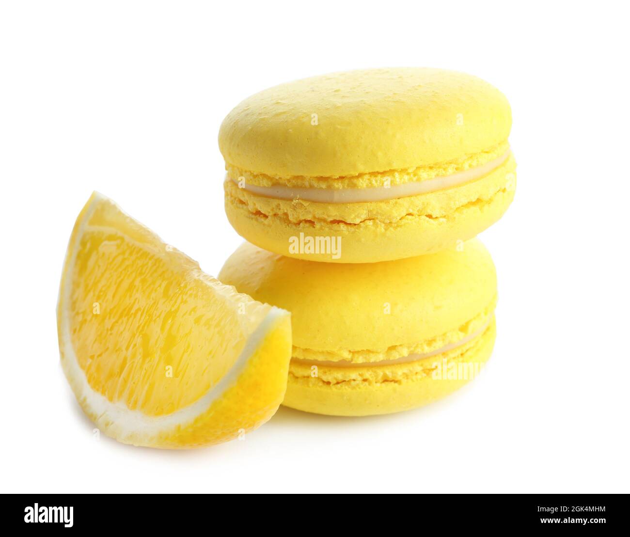 Lemon macarons and sliced fruit on white background Stock Photo - Alamy