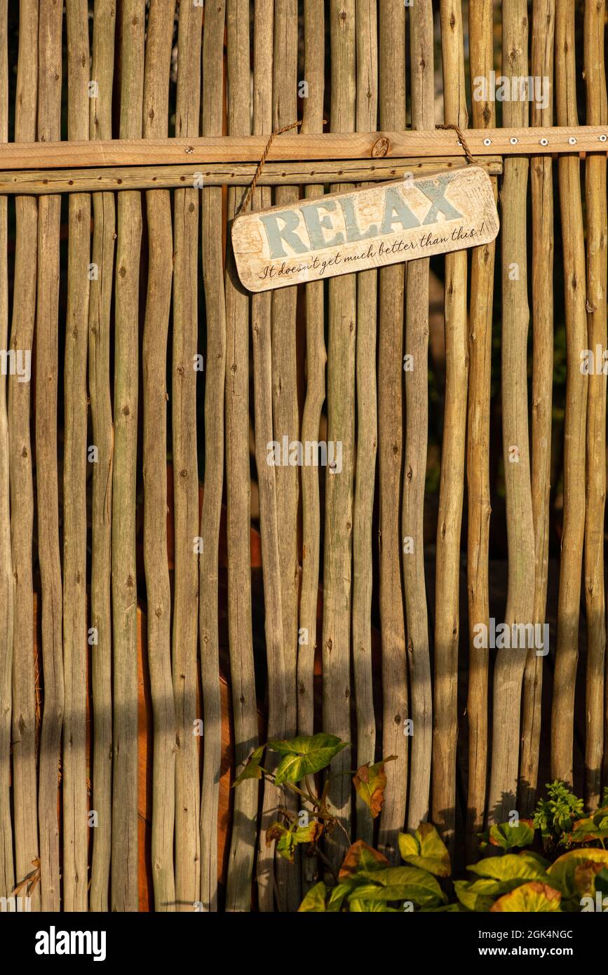 wooden stick fence with relax sign Stock Photo - Alamy