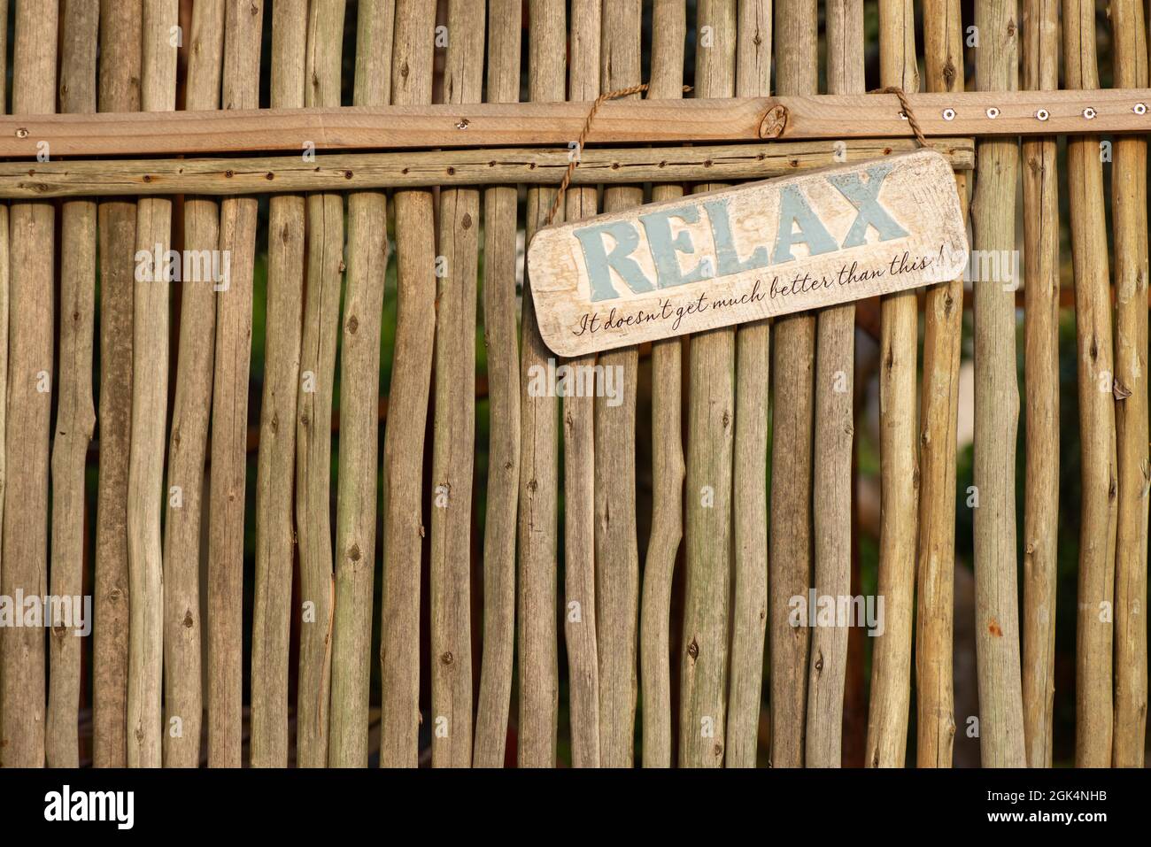 wooden stick fence with relax sign Stock Photo - Alamy