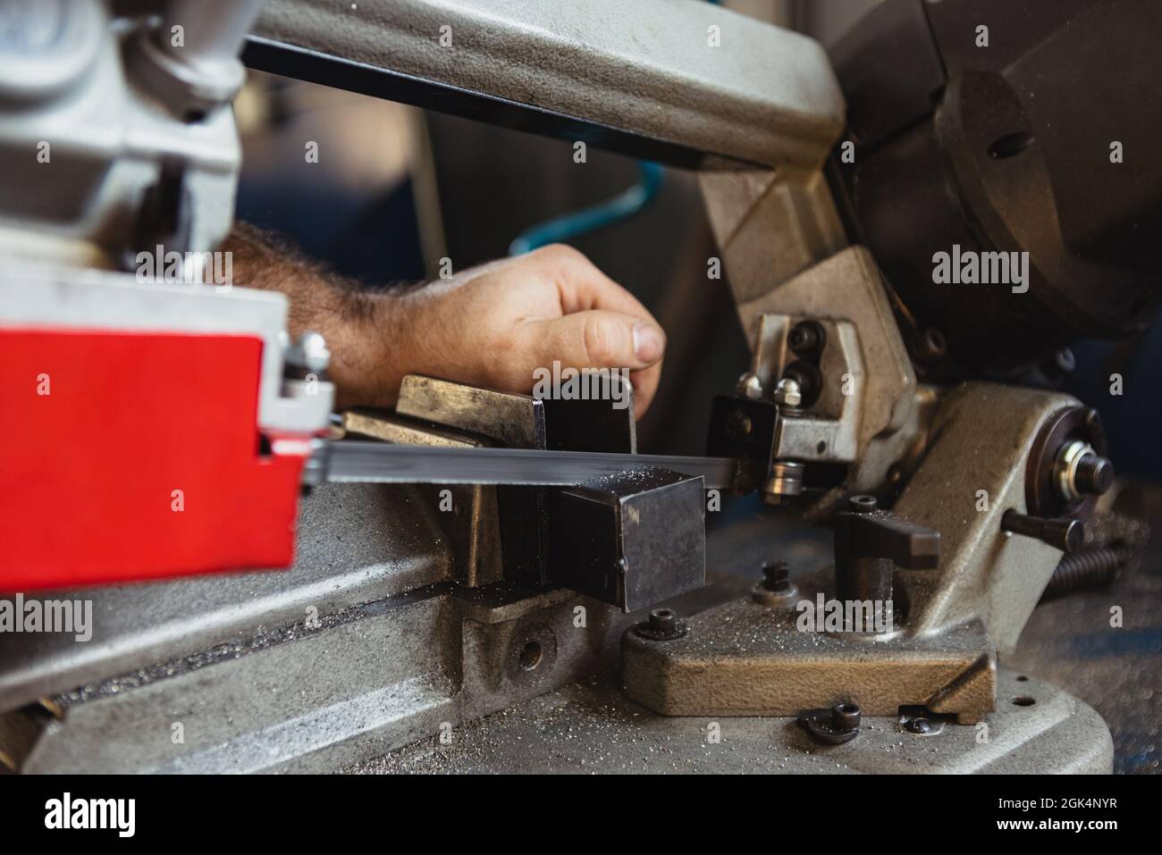 Close-up hands of male auto mechanic in dungarees with work tools ...