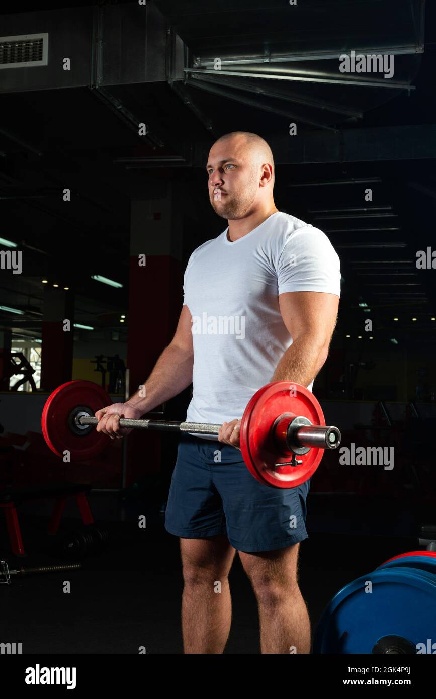 Young athlete lifts heavy barbell hi-res stock photography and images ...