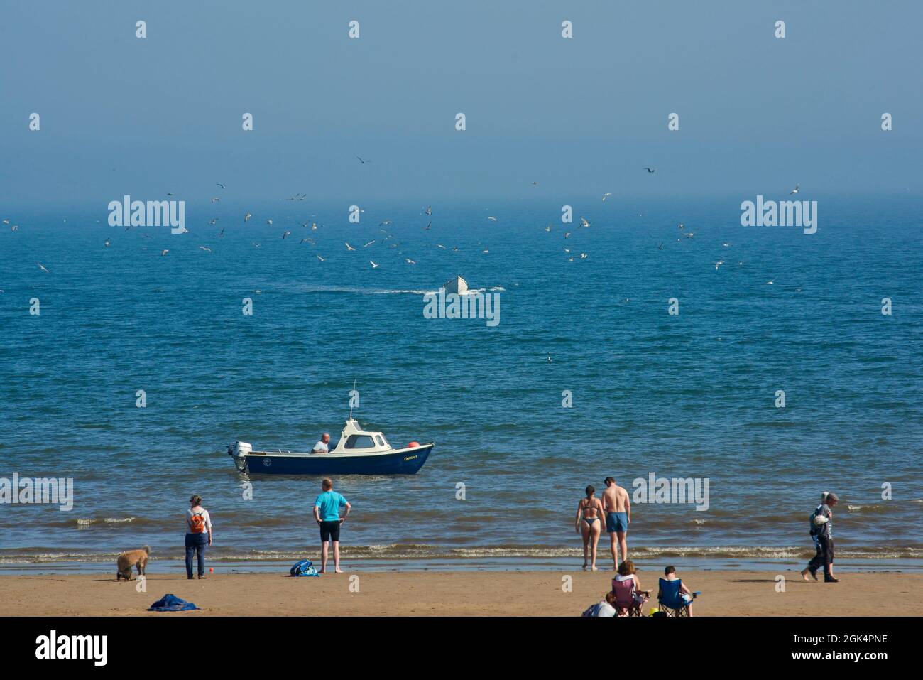 Fishing boats coming back home at Filey Beach, North Yorkshire east ...