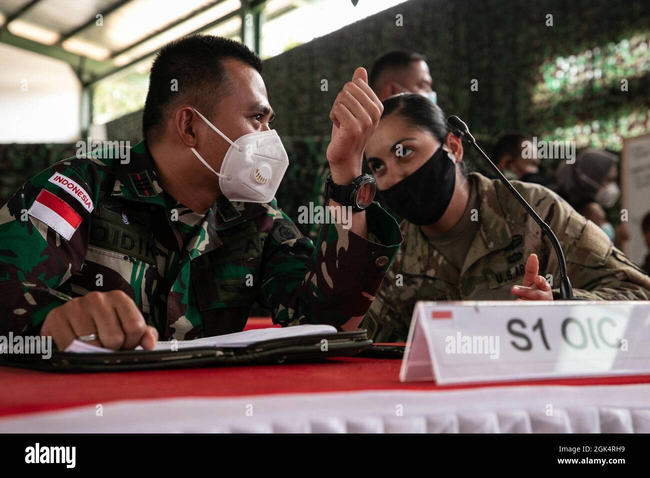 A U.S. Army Soldier, with Task Force Warrior, speaks with her Tentara ...