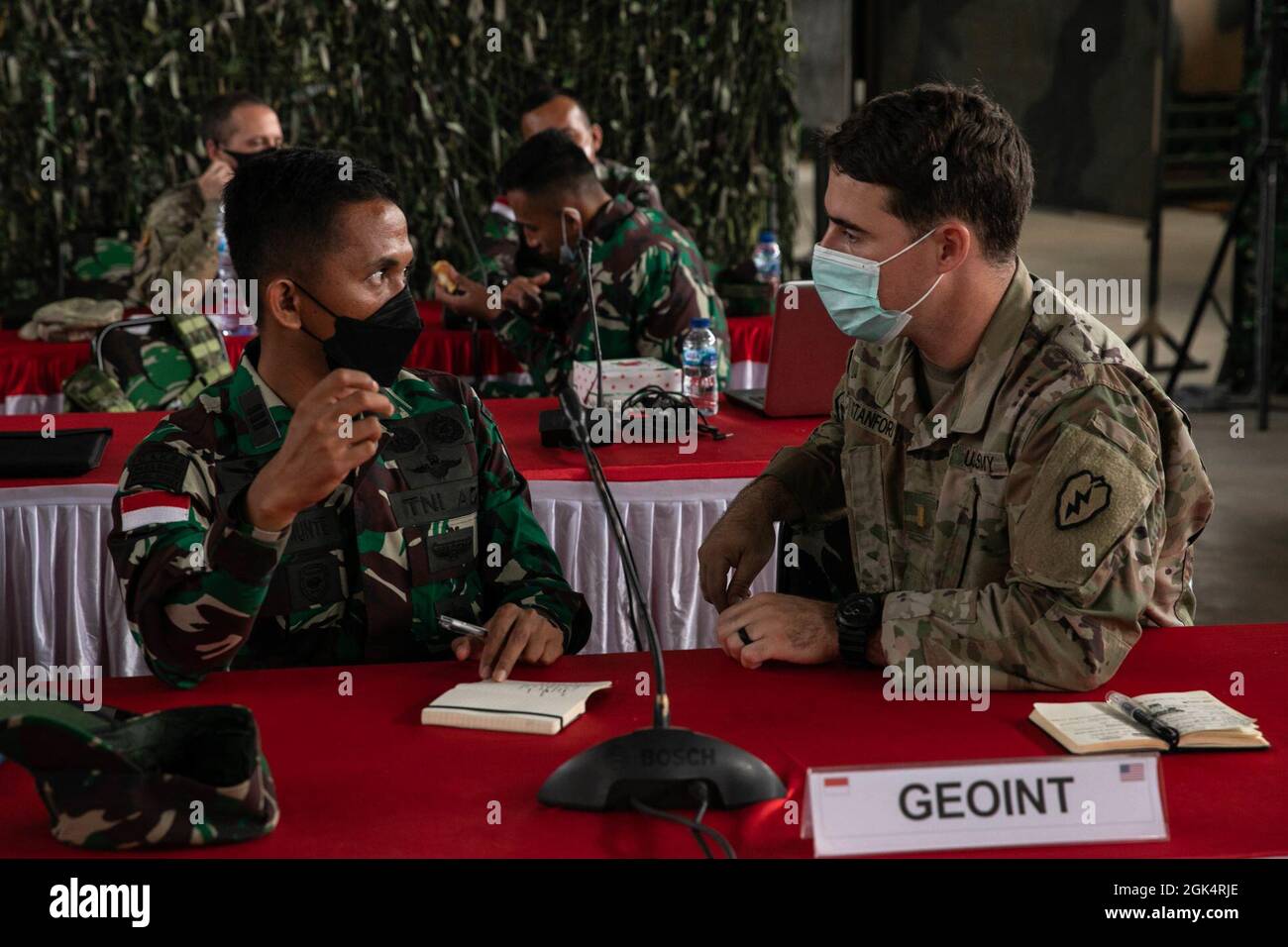 A U.S. Army Soldier with Task Force Warrior, speaks with his Tentara ...