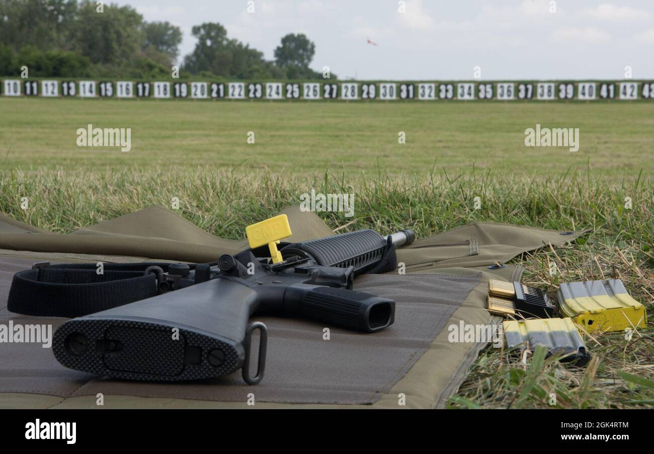 A Civilian Marksmanship Program M16A2 sits on a shooting mat during the ...