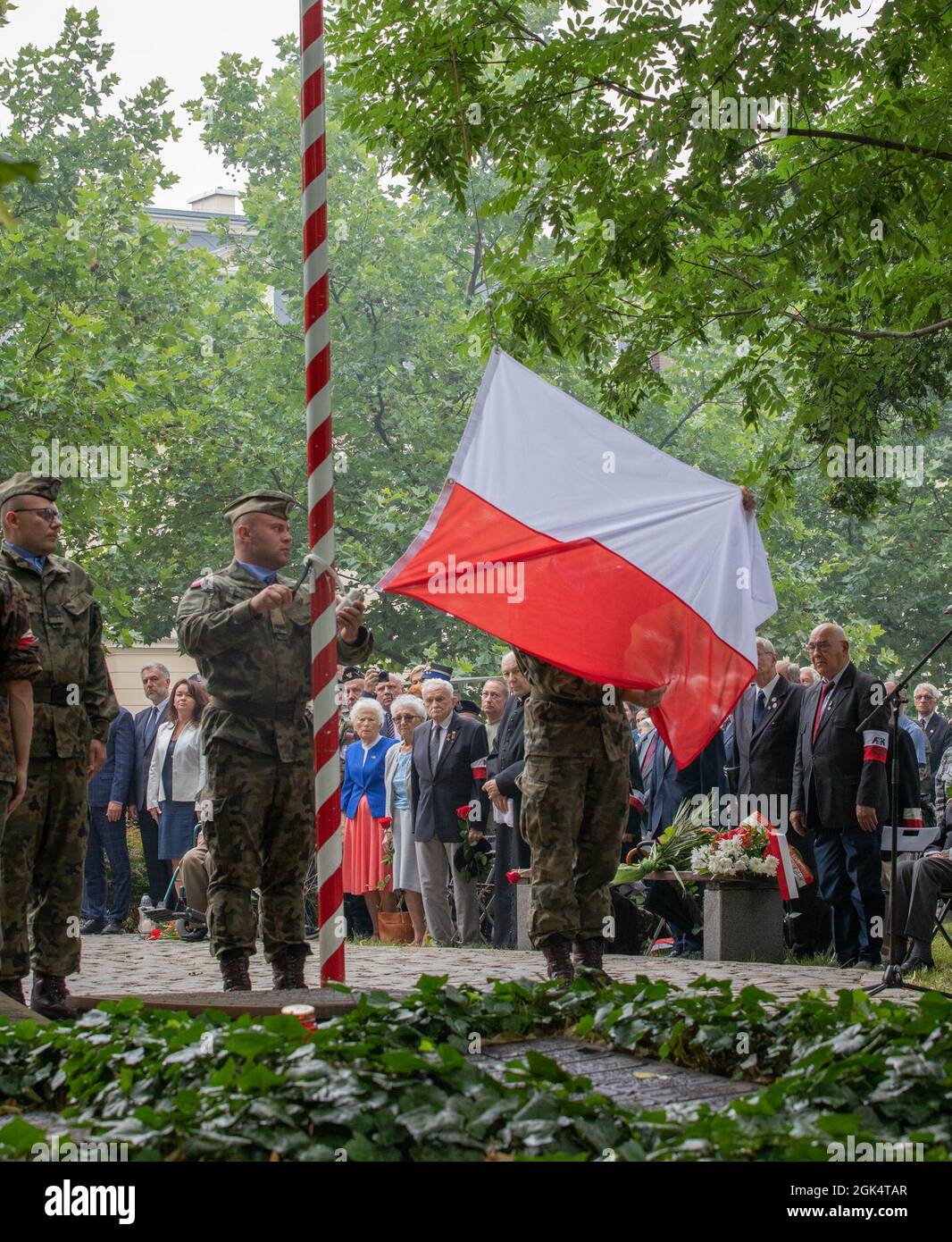 Members of the Polish Armed Forces raise their nation’s flag during the ...