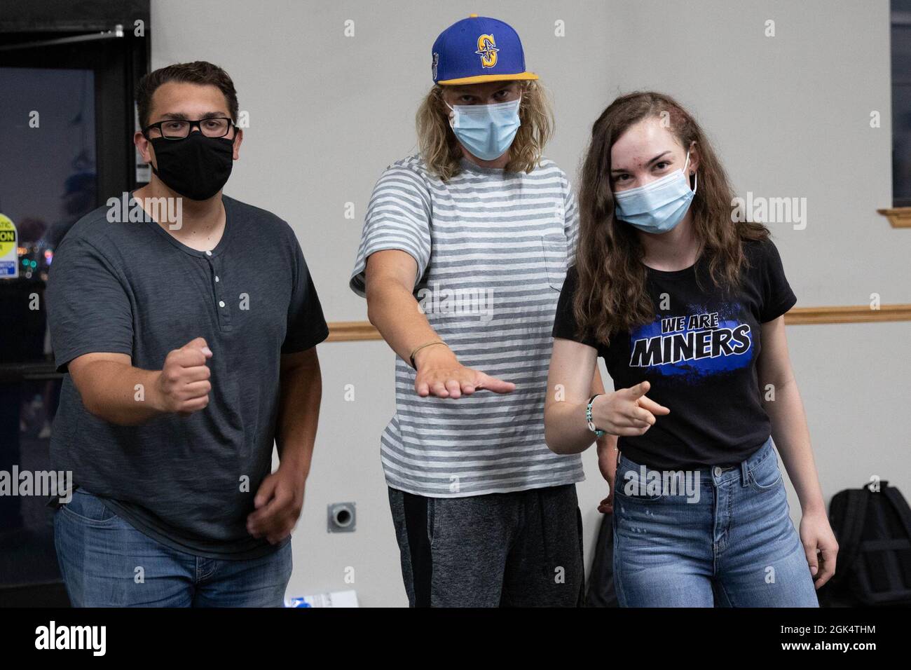 The winners of the rock-paper-scissors competition stand together for a ...