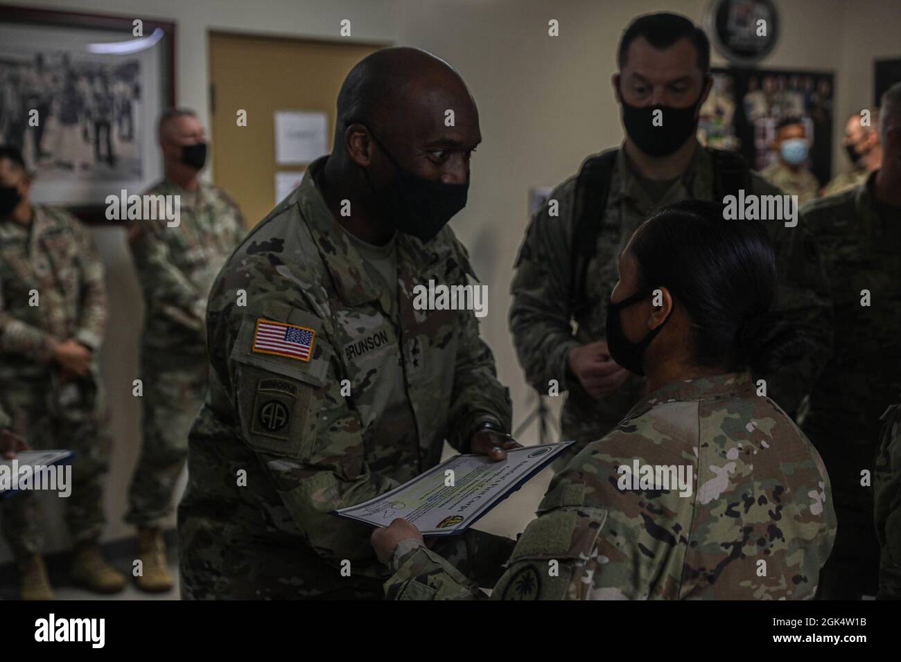 Maj. Gen. Xavier T. Brunson, the I Corps commanding general, presents a ...