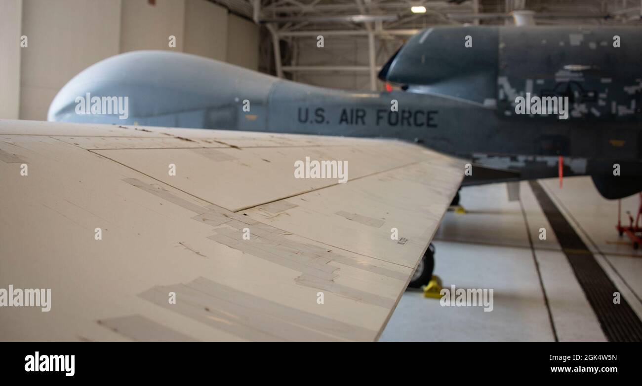 An EQ-4 Global Hawk sits in a hangar after its final landing at Grand ...
