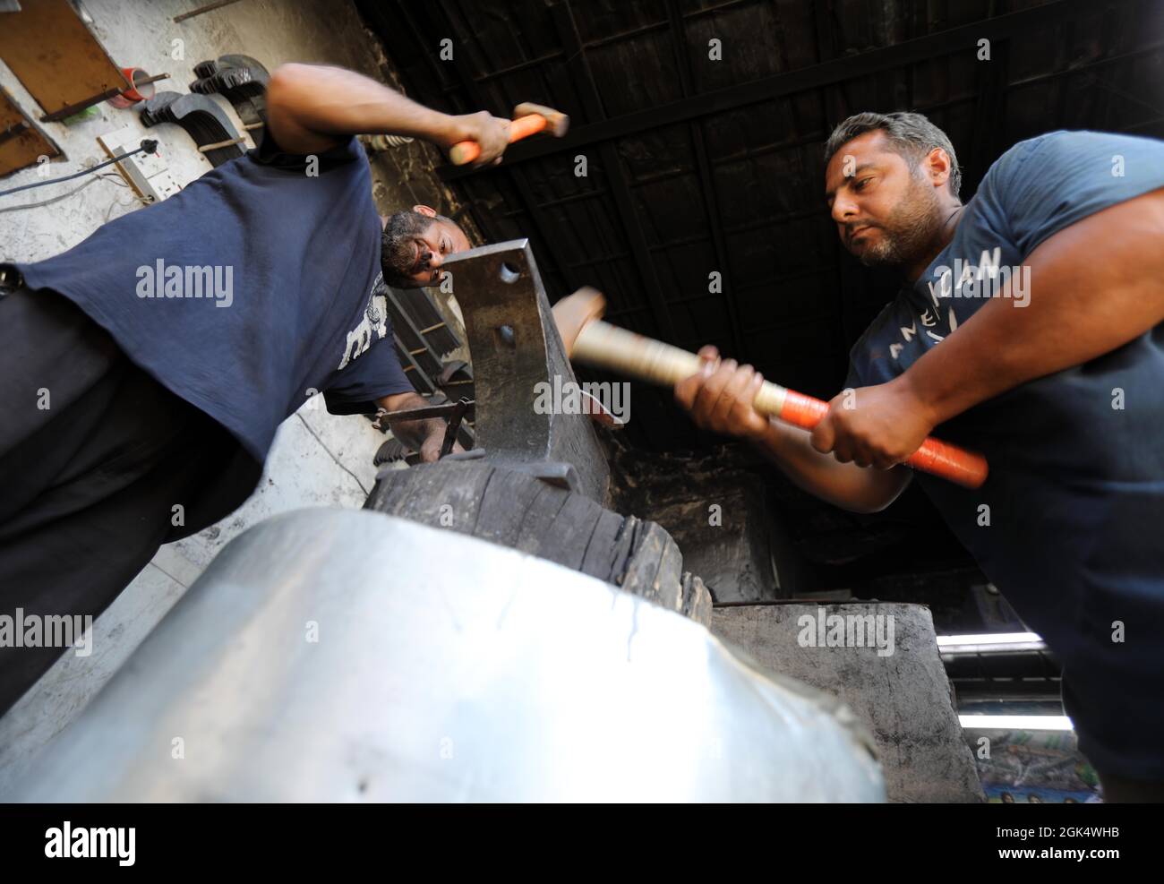 Baghdad, Iraq. 12th Sep, 2021. Blacksmiths make agricultural tools at a ...