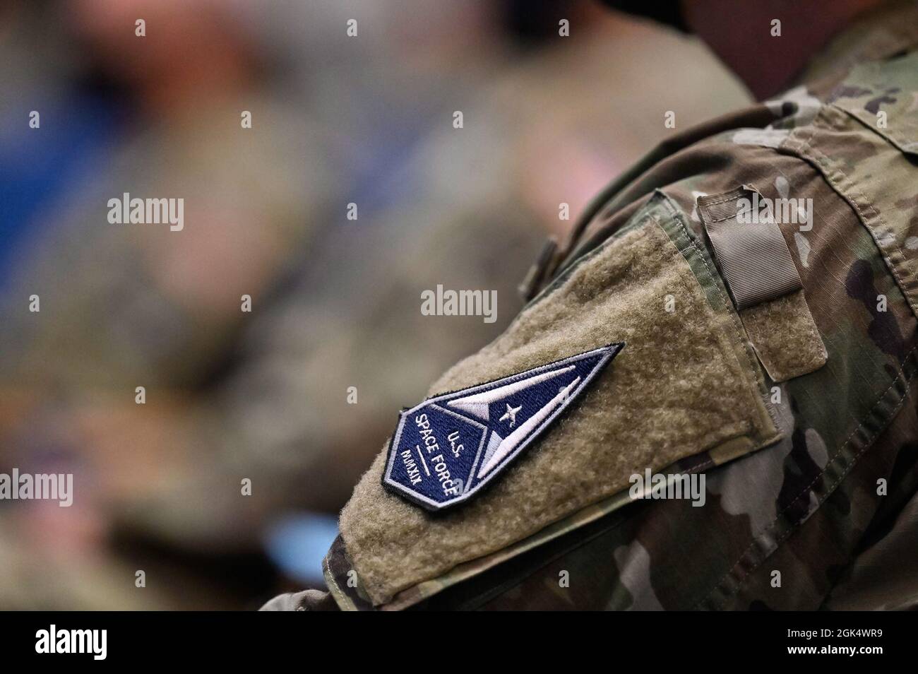A Space Force patch is affixed to an officer's uniform after a ...