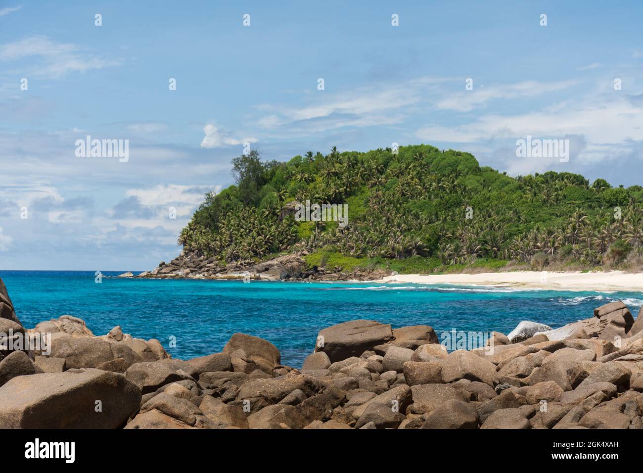 Beautiful idyllic beach with white sand beach, granite rocks, lush ...