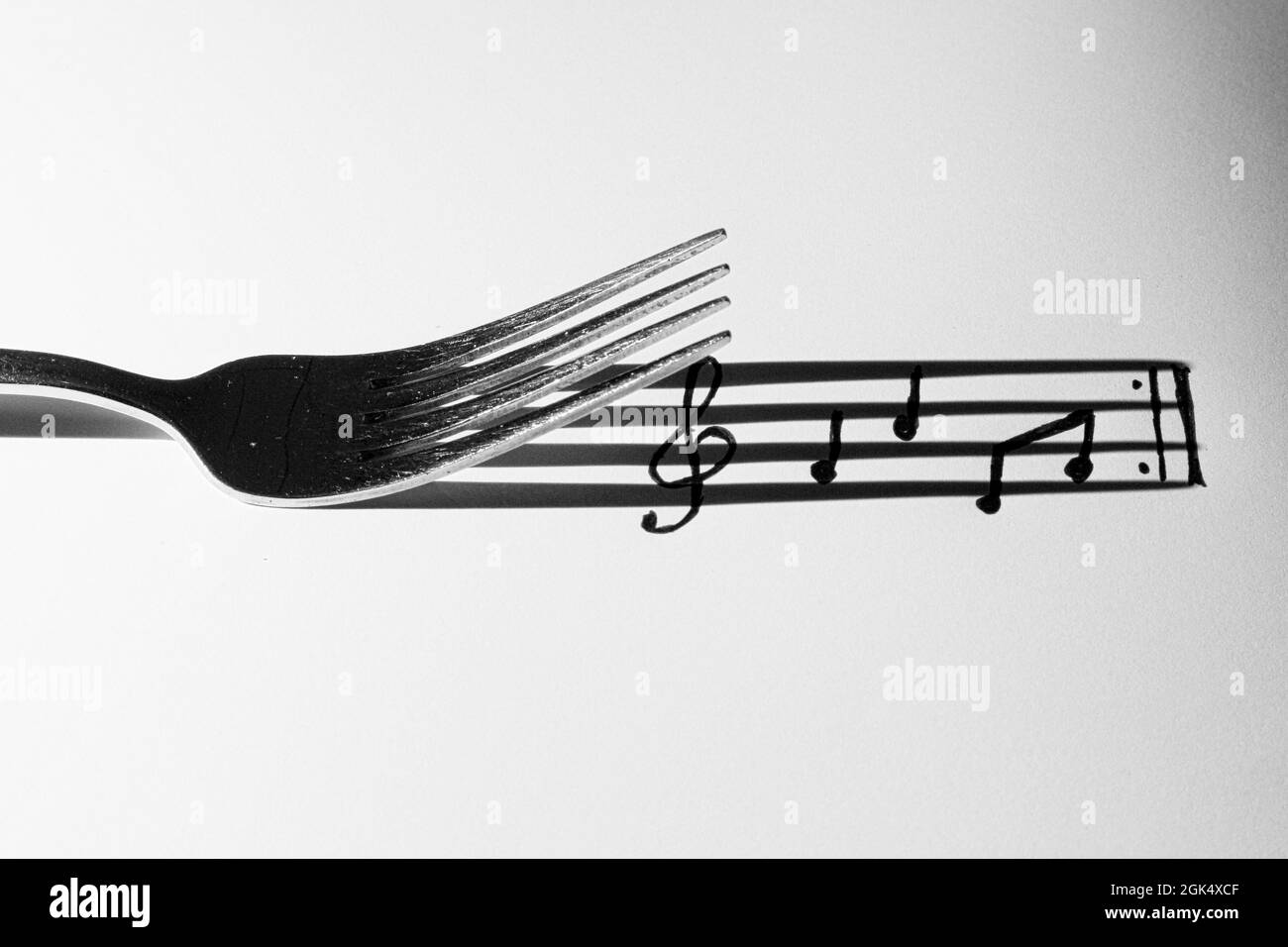 Closeup shot of a fork and its 3d rendered shadow on the white ...