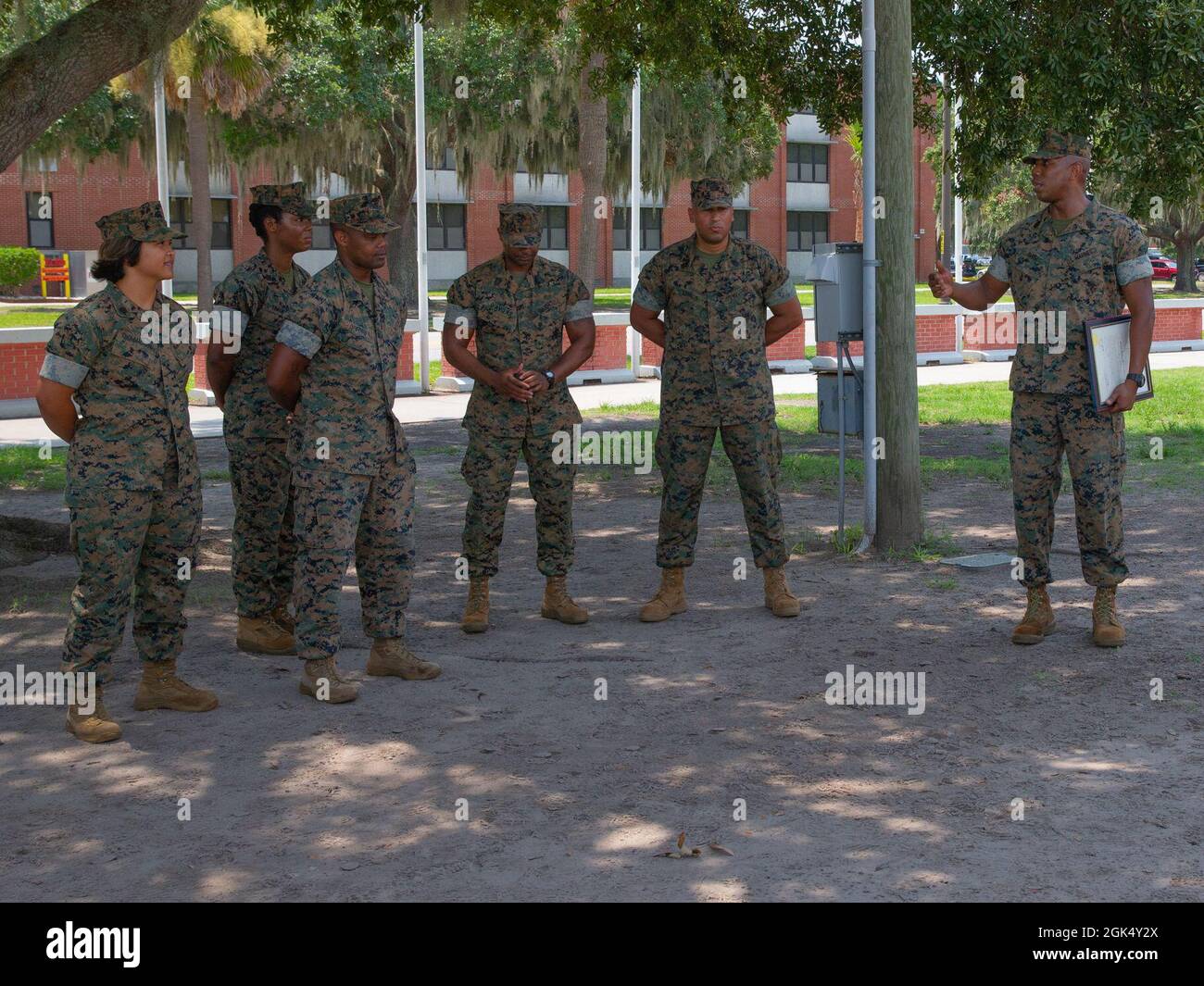U.S. Marine Corps Master Sgt. David E. Smith, right, addresses the ...