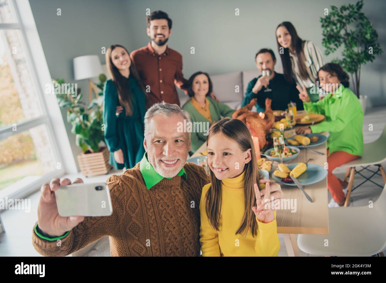 Photo of pretty cute family eating holiday turkey sitting table showing ...