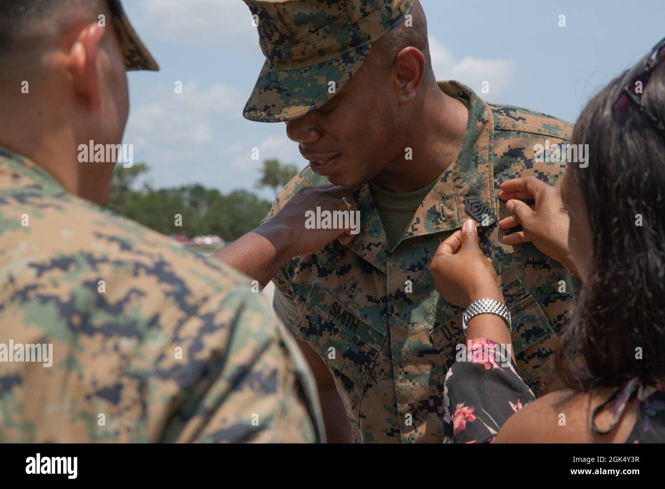 U.S. Marine Corps Master Sgt. David E. Smith gets pinned by his wife ...
