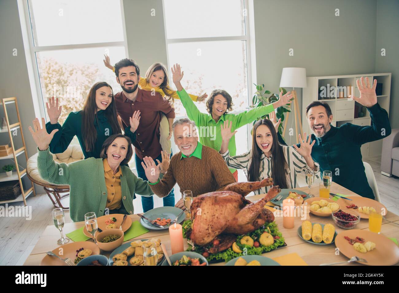 Photo of cute friendly family eating holiday turkey smiling sitting ...