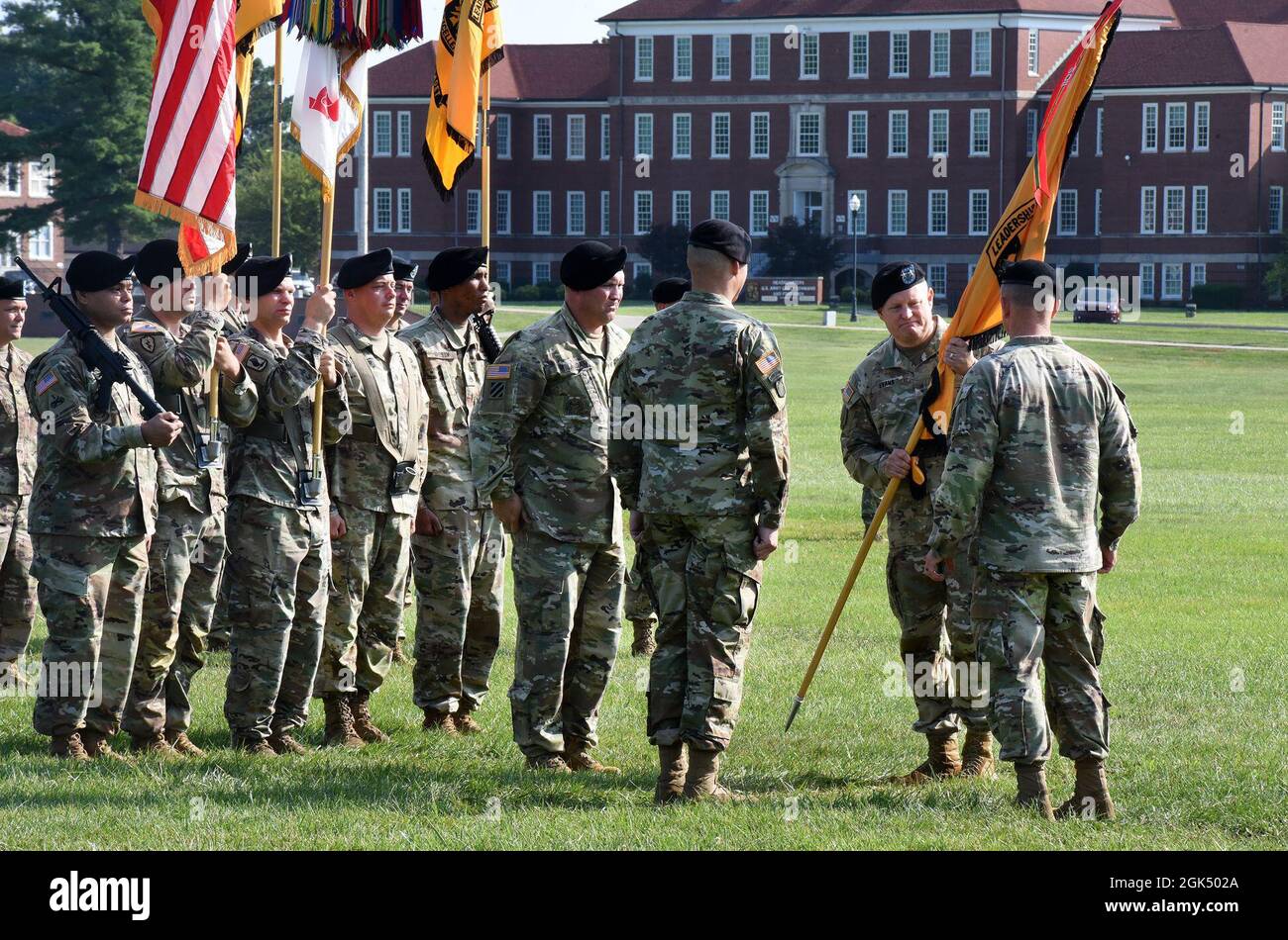 Maj. Gen. John Evans Jr. passes the U.S. Army Cadet Command colors to TRADOC Commander Gen. Paul ...
