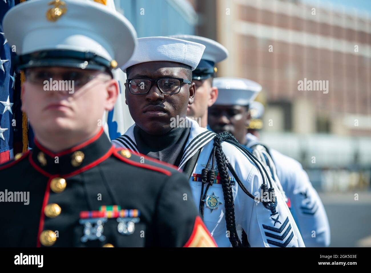 A joint service color guard stands by at the Coast Guard Station St ...