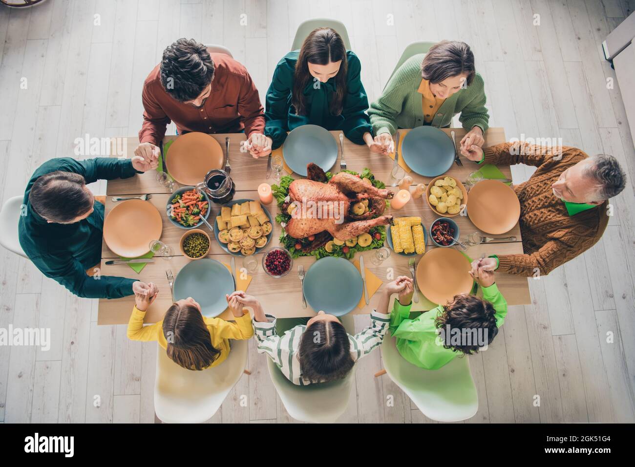 High angle photo of adorable cute family eating holiday turkey sitting ...
