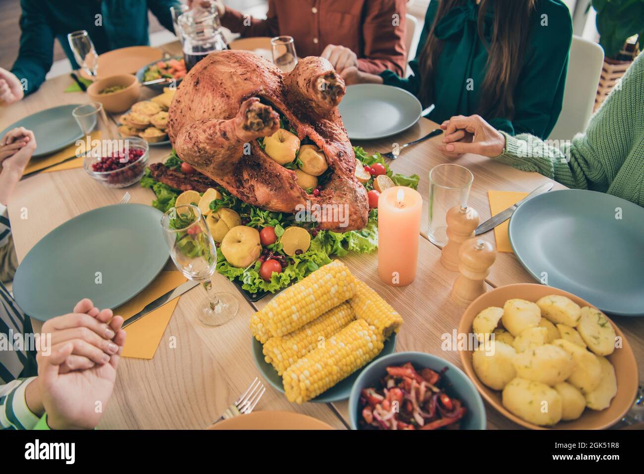 Photo of pretty adorable family eating holiday turkey sitting table ...