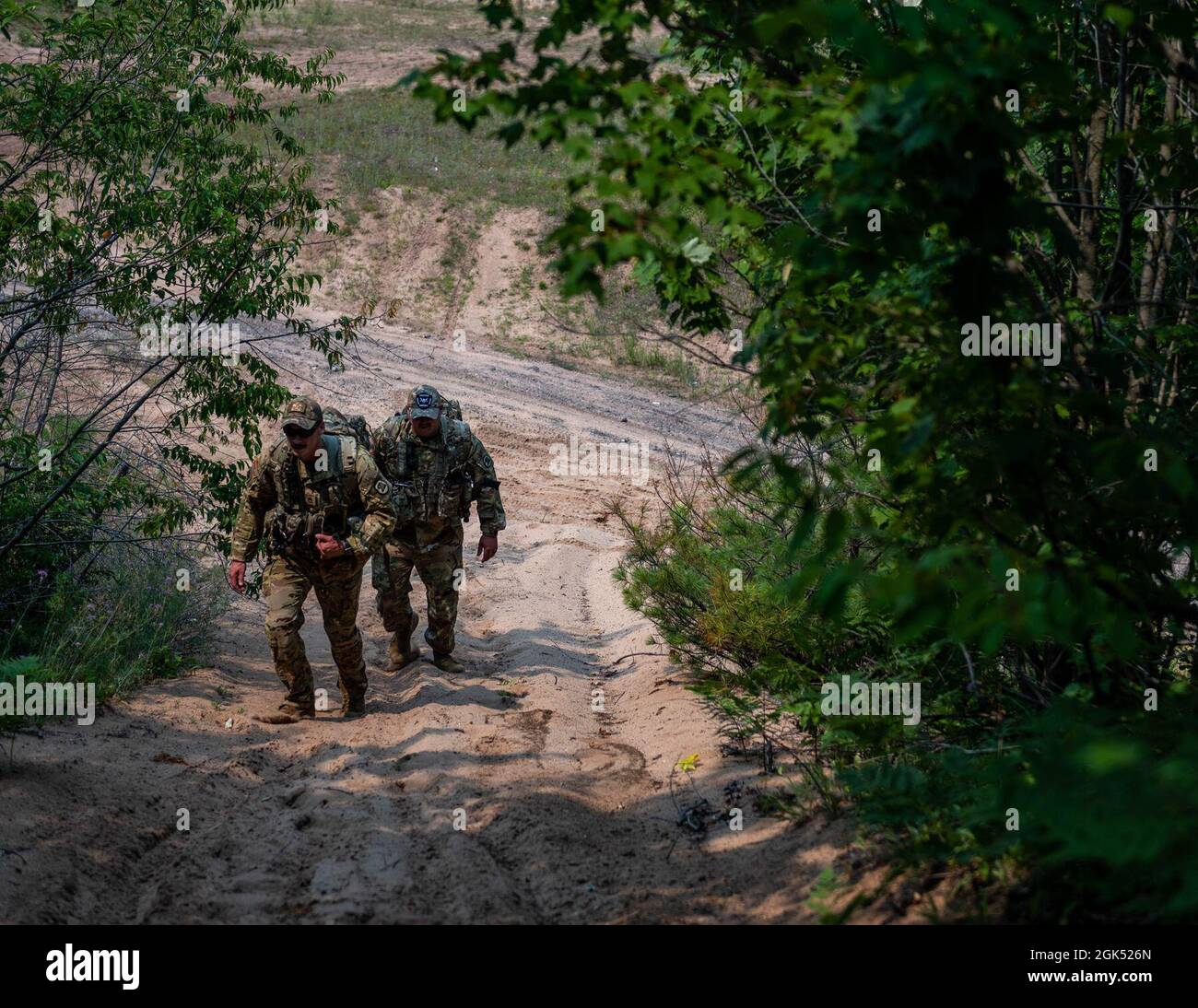 U.S. Army Staff Sgt. Wyatt Brown, left, 2-211th Army Regiment flight ...