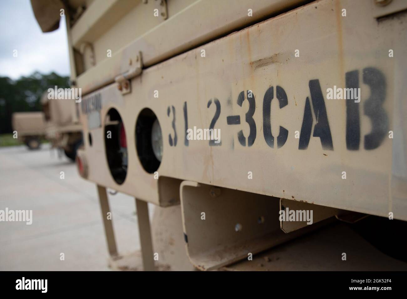 Medium tactical vehicles sit in formation as the Soldiers of the 2nd ...