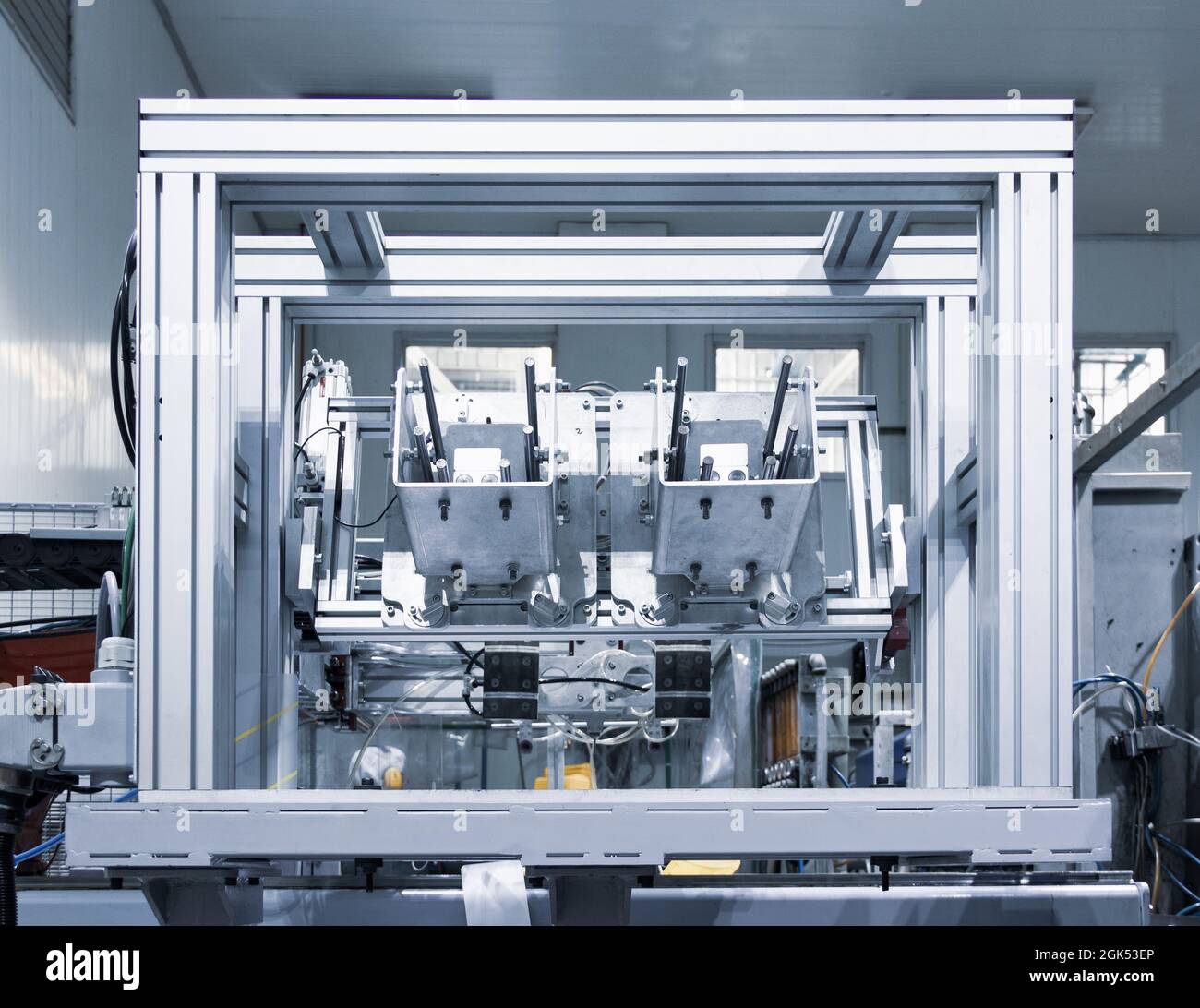 Symmetric square aluminum industrial robot. Plastic containers factory ...