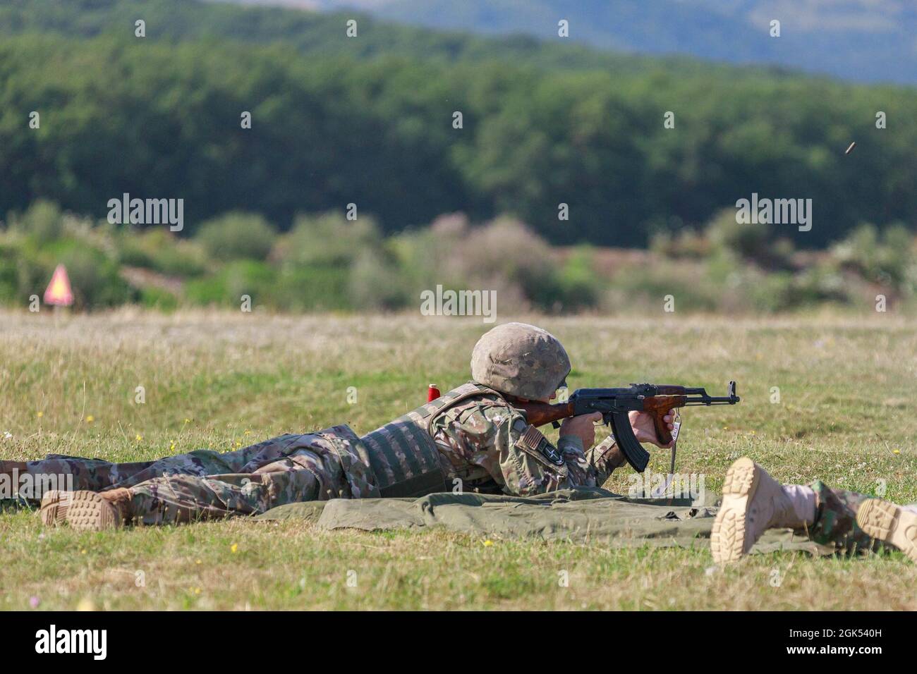 An Army Reserve Soldier fires an AK-47 rifle during a rifle ...