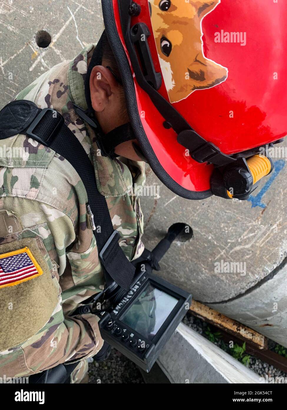 A search and rescue Soldier uses technology to find notional victims at ...