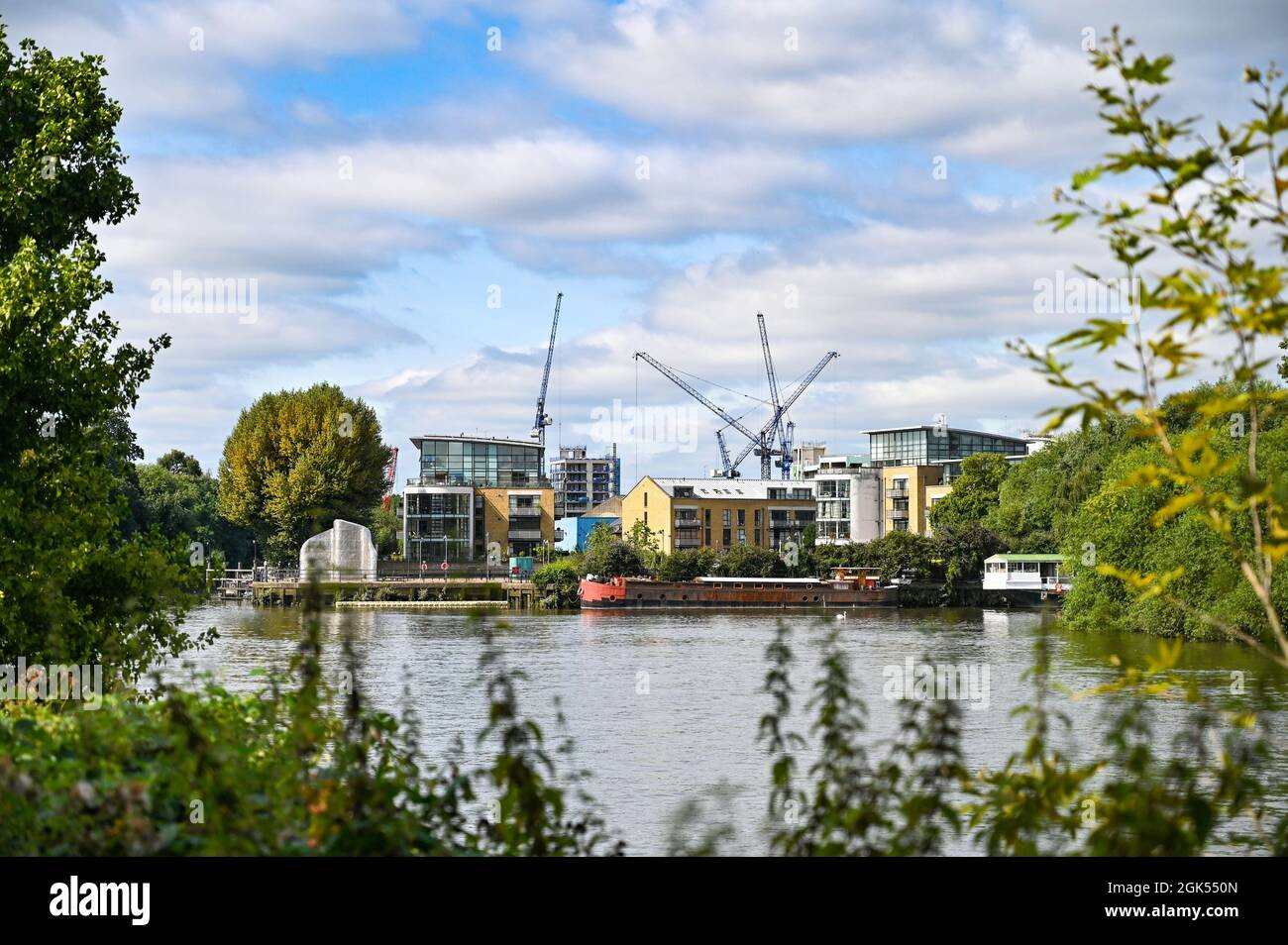 View across rIver Thames from Kew towards Brentford and Chiswick West ...