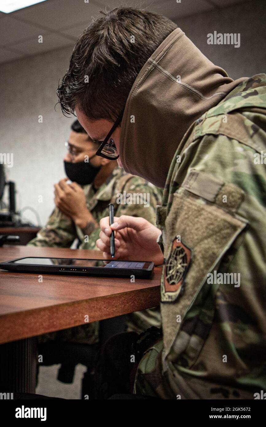 An Airman assigned to the 305th Aerial Port Squadron uses the Real-time ...