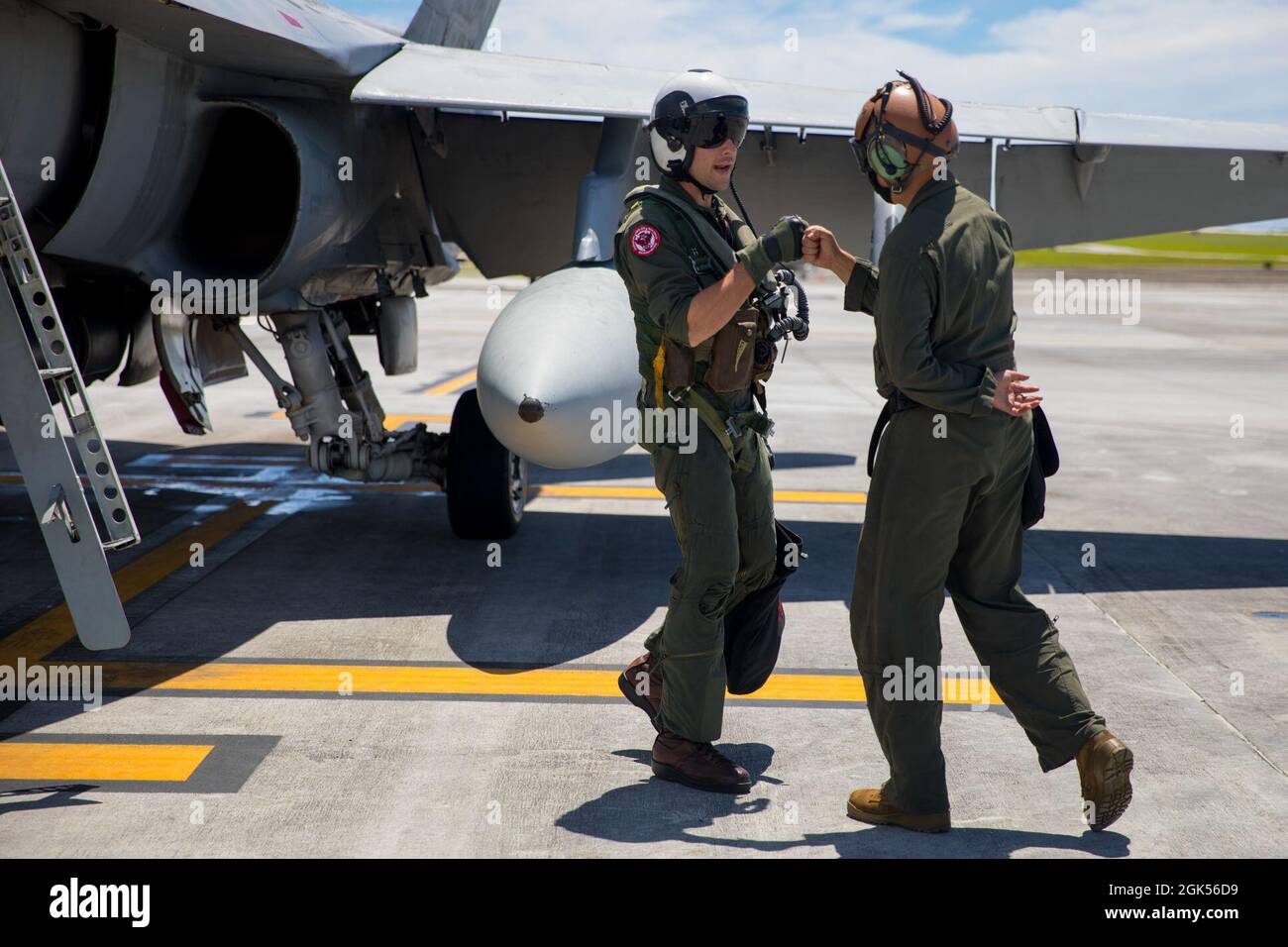 U.S. Marine Corps Capt. Tyler Millard, an F/A-18 Hornet pilot, left ...
