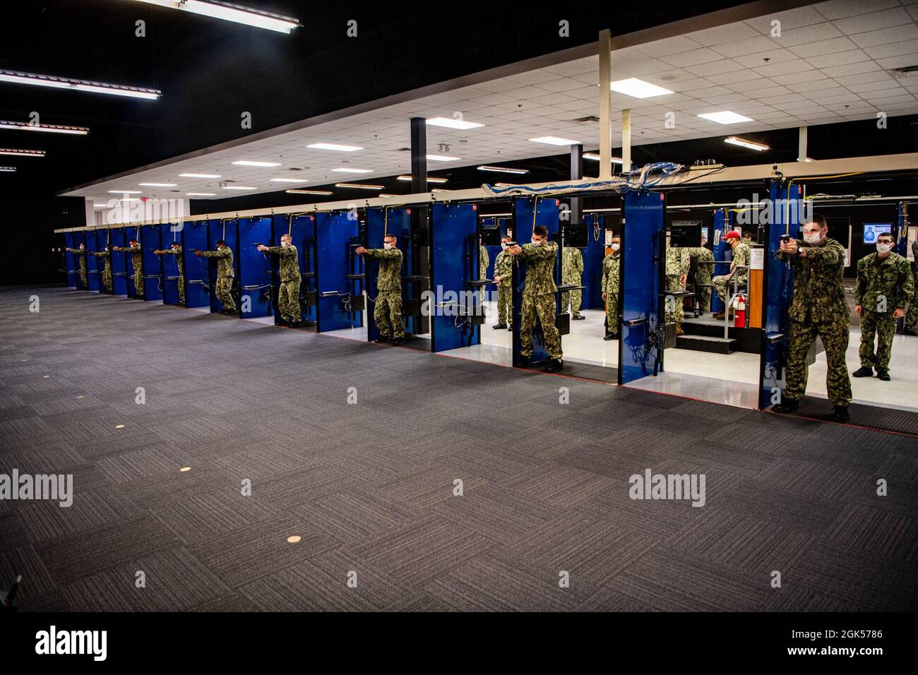 Recruits fire a simulated M9 Beretta during weapons familiarization ...