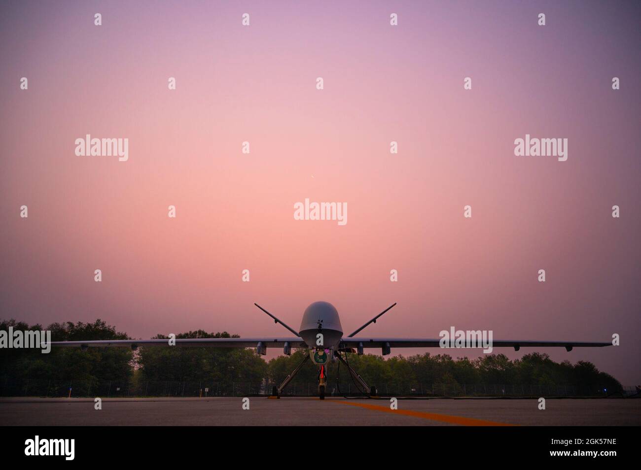 An MQ-9 Reaper sits on the flightline before a morning launch during ...