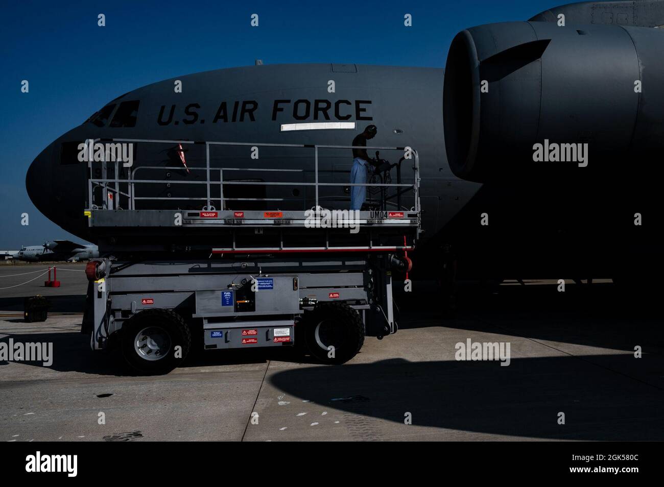 An Airman assigned to the 911th Aircraft Maintenance Squadron maneuvers ...