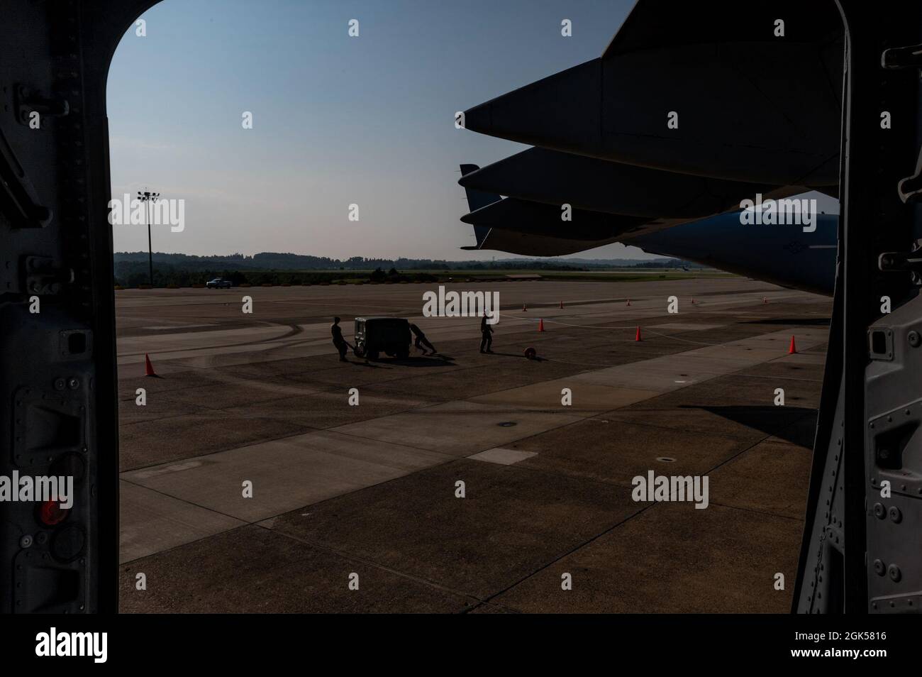 Airmen assigned to the 911th Aircraft Maintenance Squadron maneuver a ...