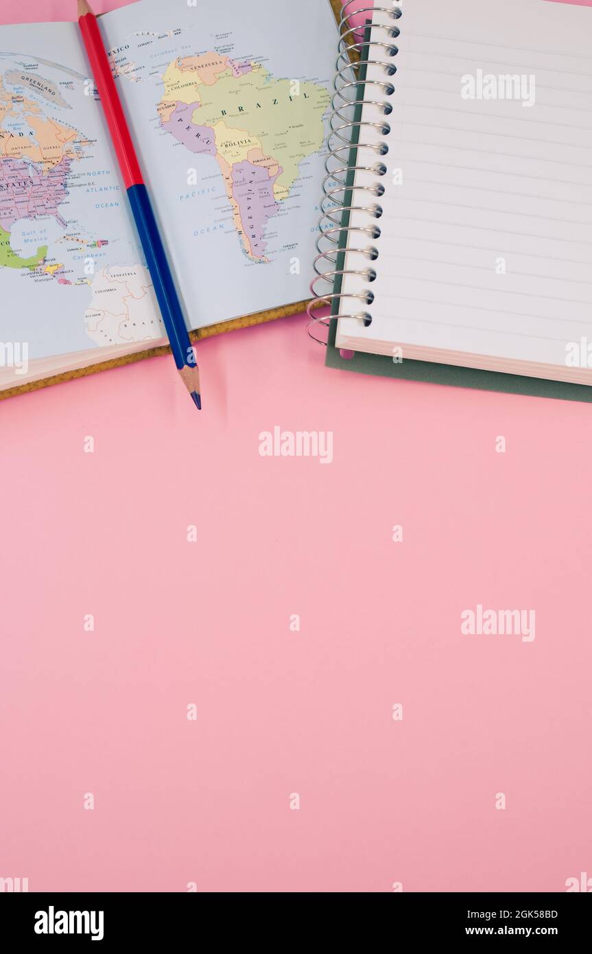 Top view of a two-sided pen and a notebook on a pink background Stock ...