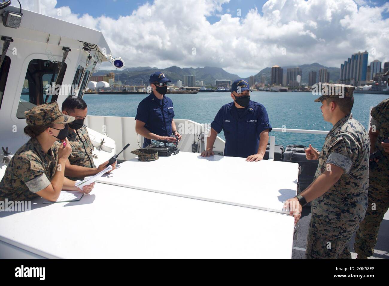 Coast Guard Cutter William Hart crewmembers speak with Marines from the ...