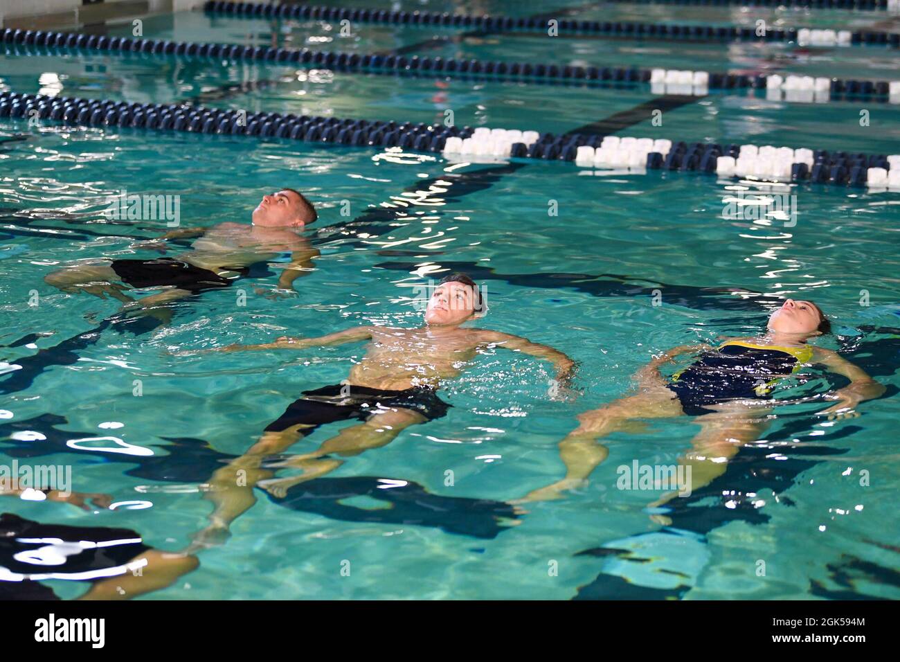 Naval Reserve Officers Training Corps midshipmen perform the back float ...