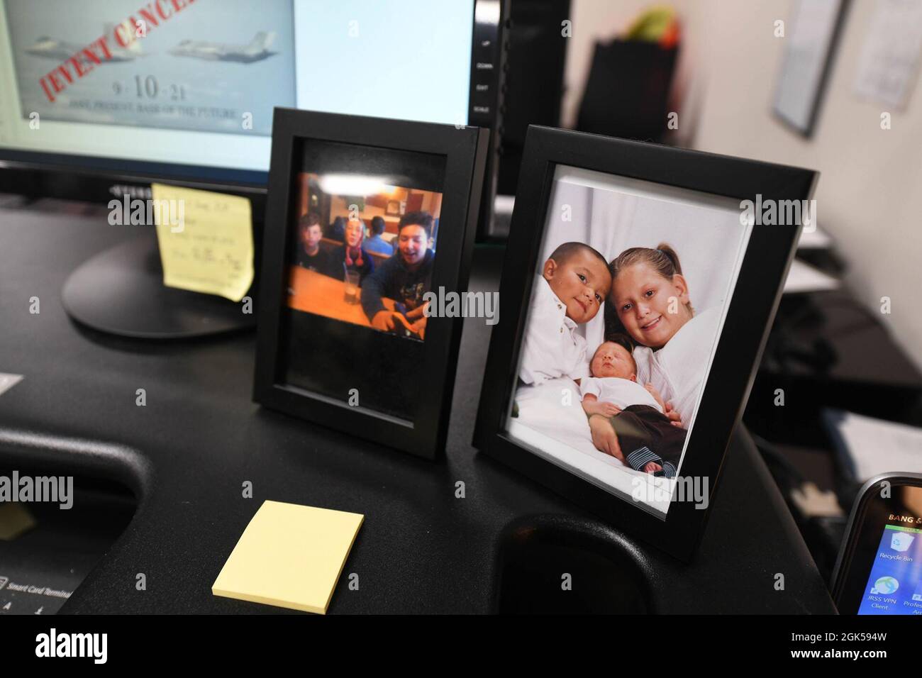 Family photos sit on the desk of U.S. Air Force Airman 1st Class Hailey ...