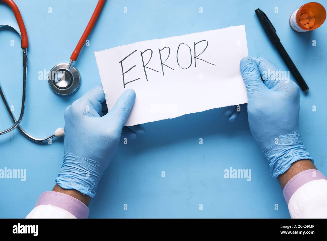 medical error text on a paper with pills and stethoscope on table Stock ...