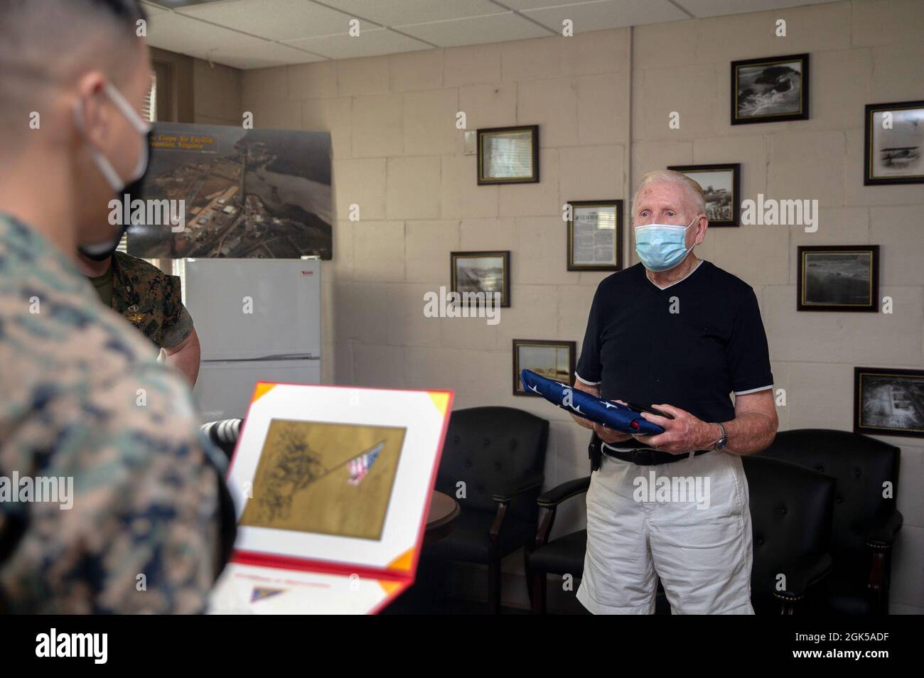 U.S. Marine Corps veteran 1st Lt. Richard B. Bagby, receives an ...