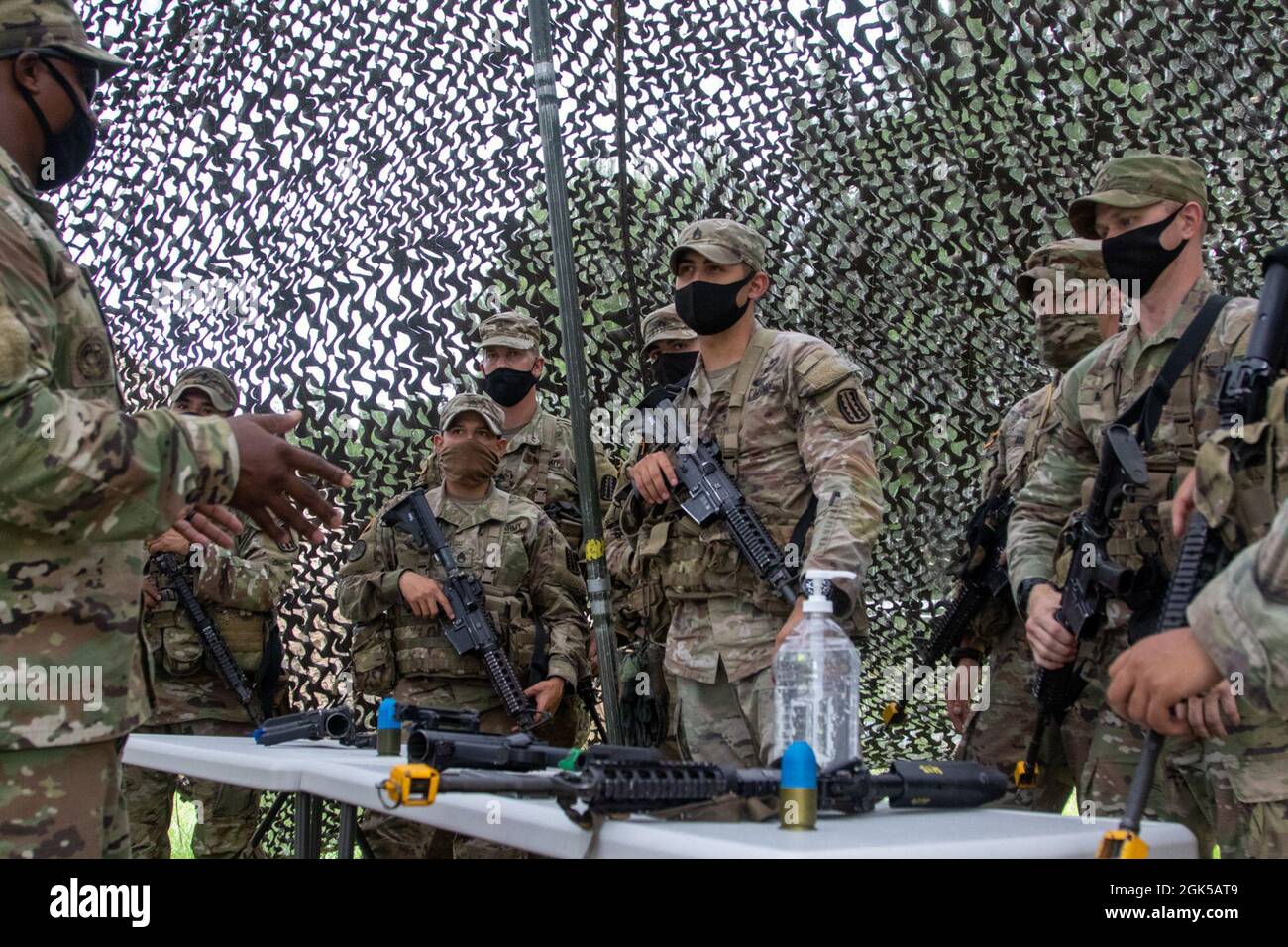 Soldiers assigned to the 3rd Infantry Division receive instructions on ...