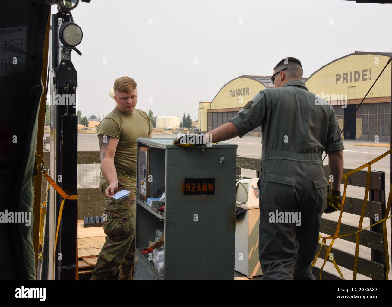 92nd Aircraft Maintenance Squadron Airmen load equipment off a KC-135 ...